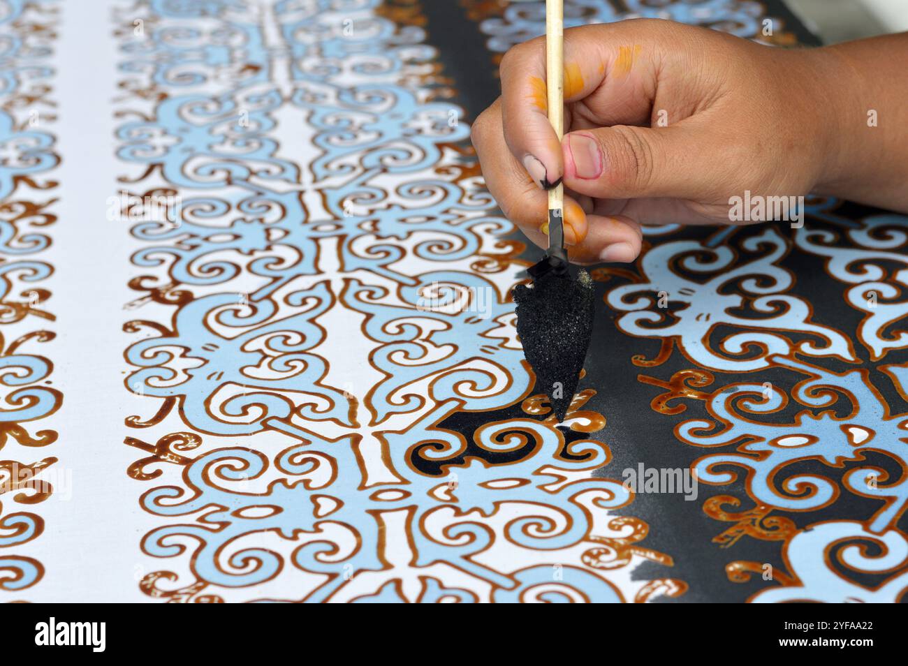 coloring process on Indonesian batik cloth Stock Photo - Alamy