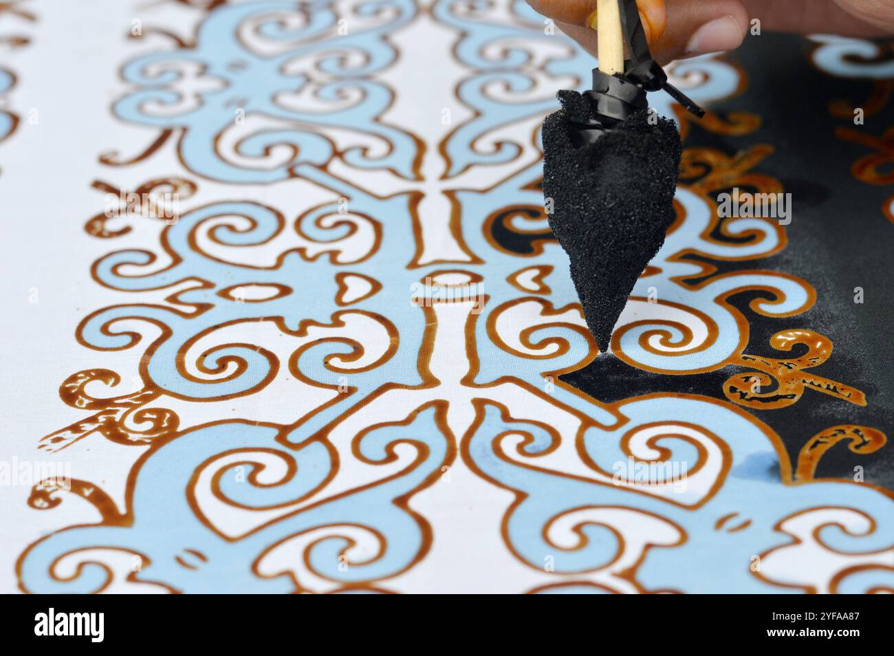 coloring process on Indonesian batik cloth Stock Photo - Alamy