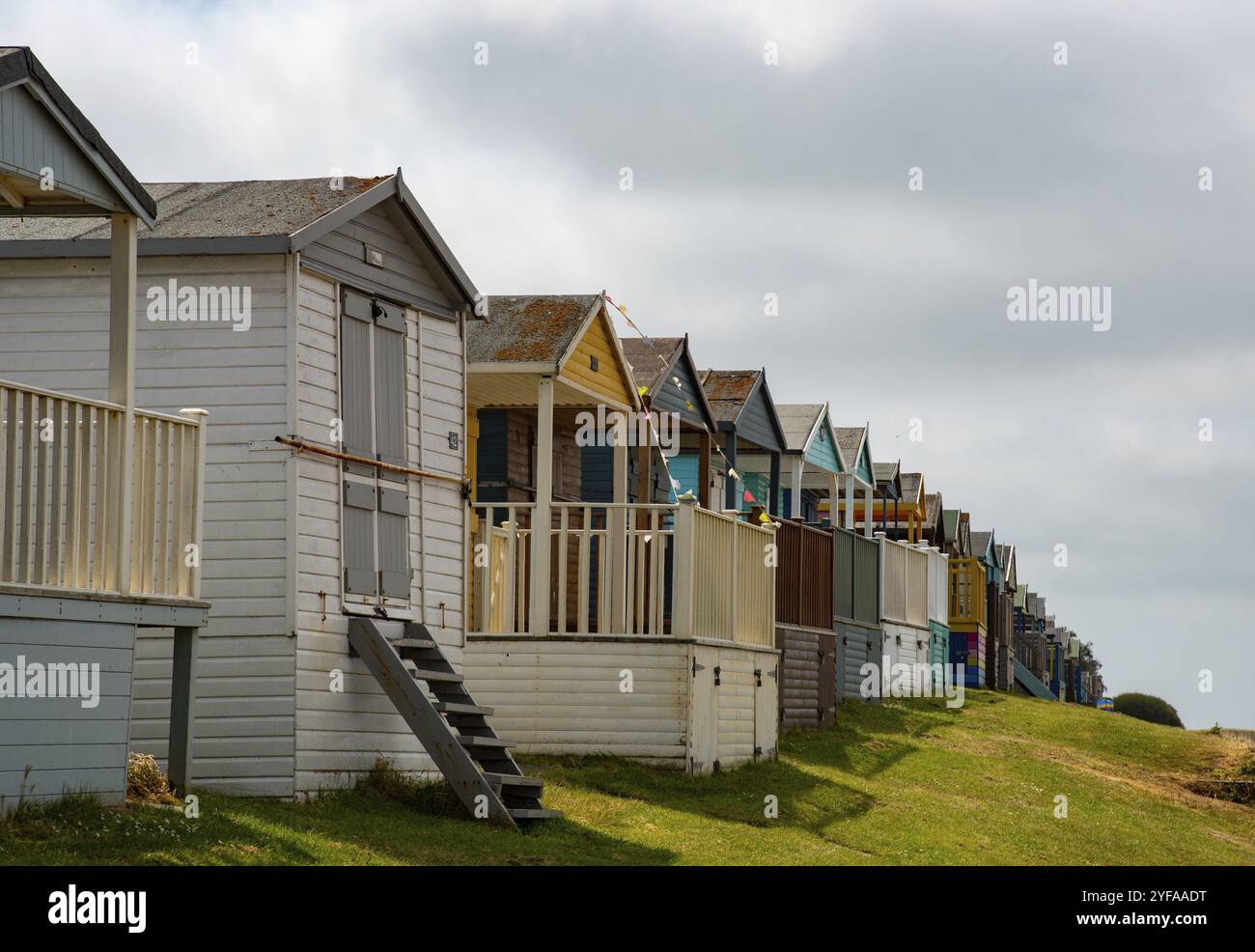 Colorful holiday beach huts. Vacations coastal wooden houses ...