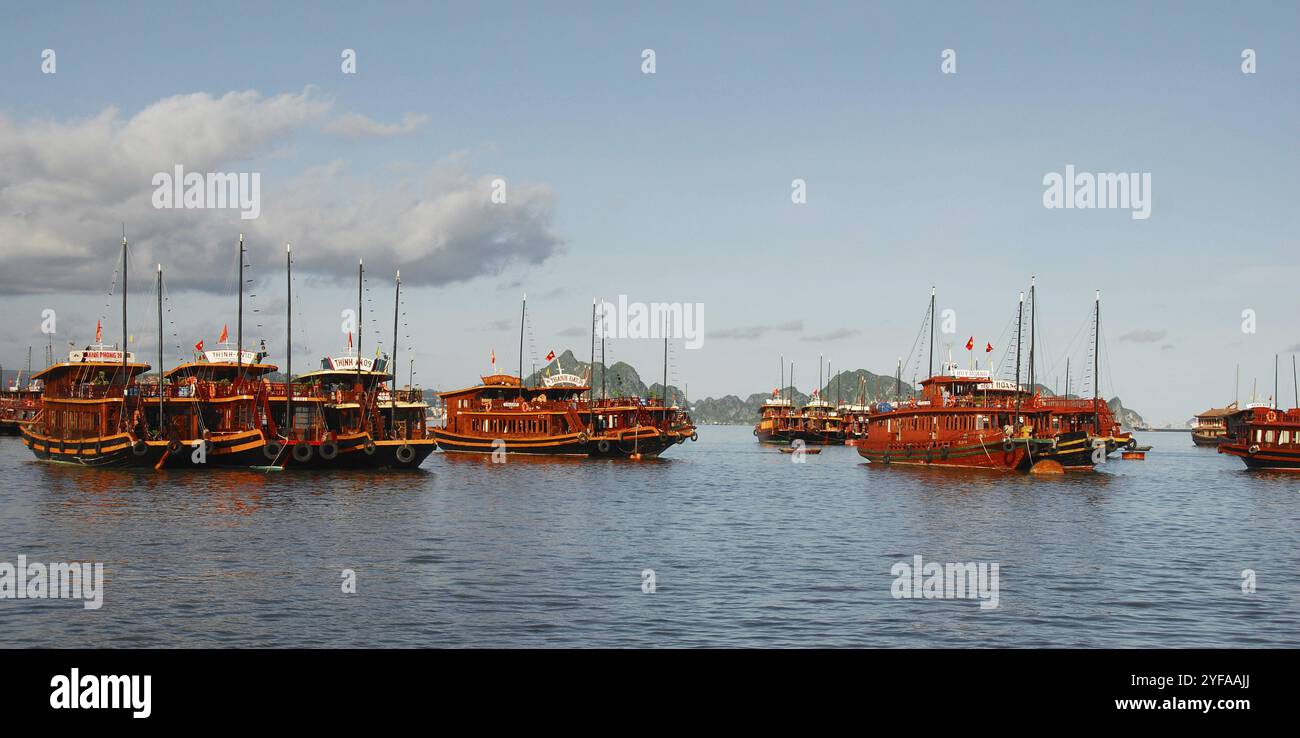 Small wooden tourist boats at the famous Halong Bay in Vietnam Asia ...