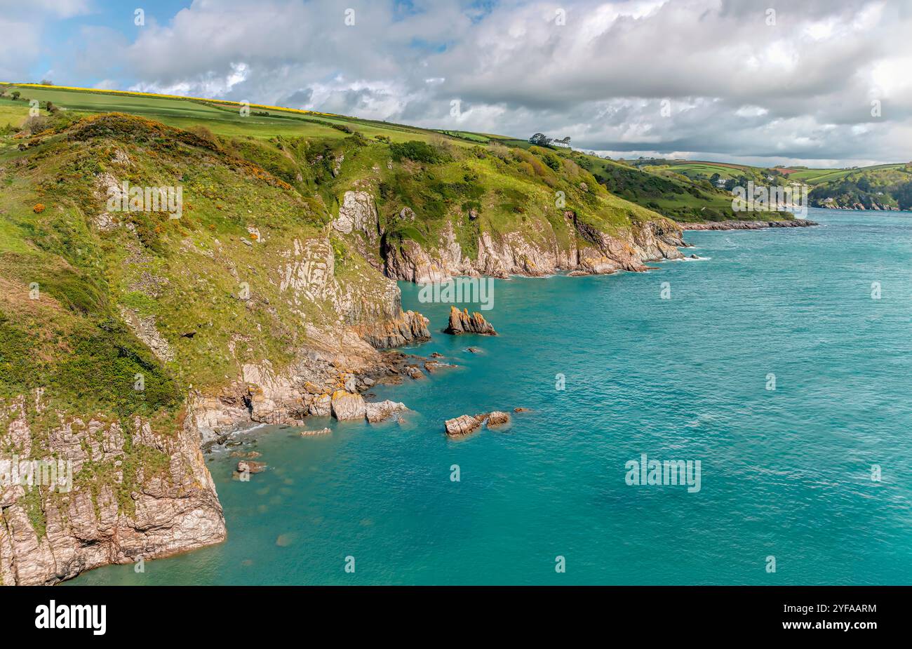 Scenic coastline at the mouth of the Dart River, Devon, England, UK ...