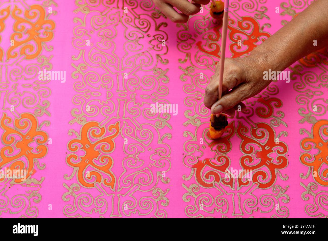 coloring process on Indonesian batik cloth Stock Photo - Alamy