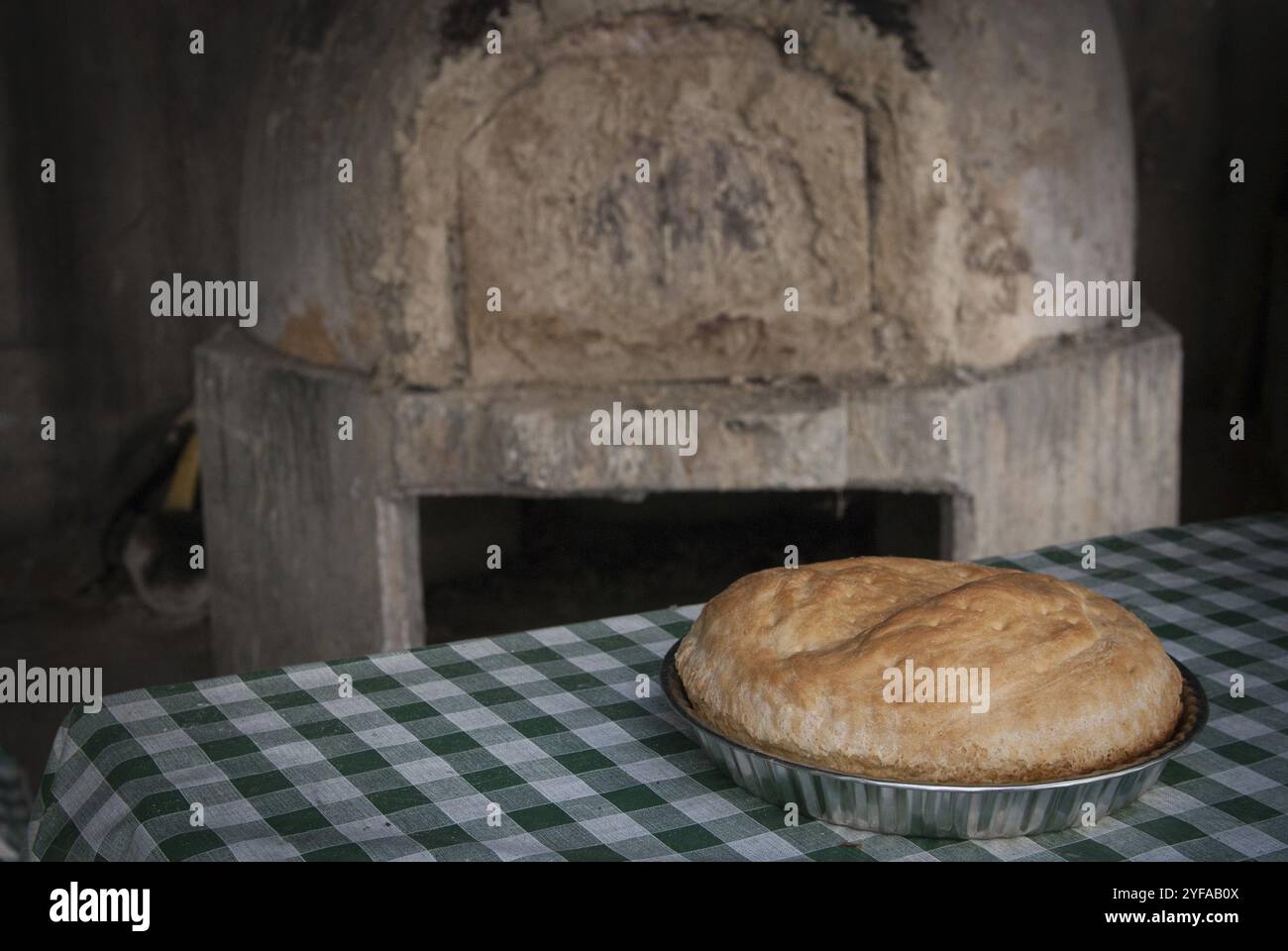 Fresh homemade bread cooked on a traditional clay oven. Home bakery ...