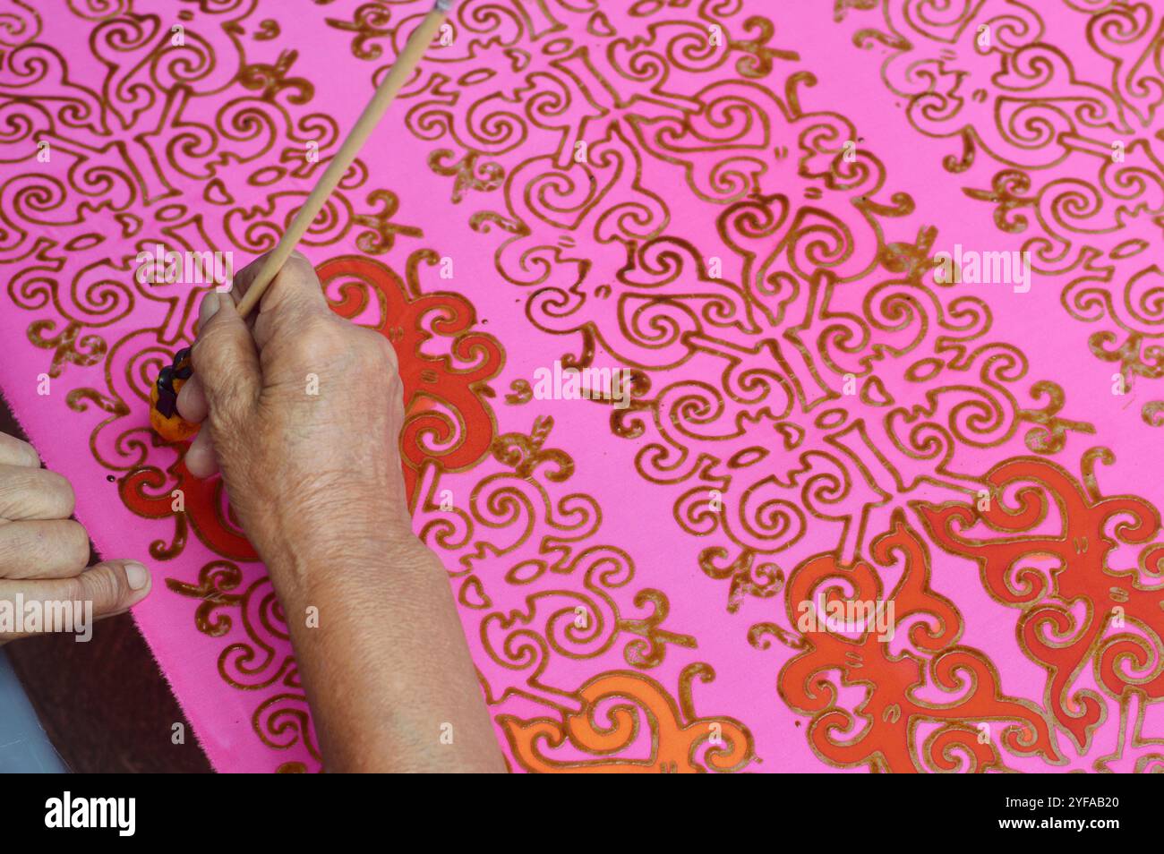 coloring process on Indonesian batik cloth Stock Photo - Alamy