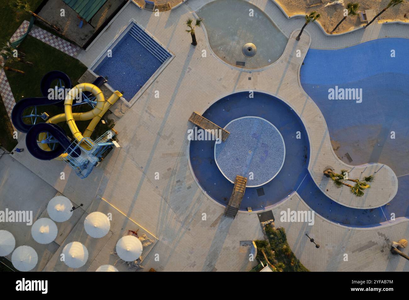 Drone aerial of empty swimming pool and water park. Deserted holiday ...