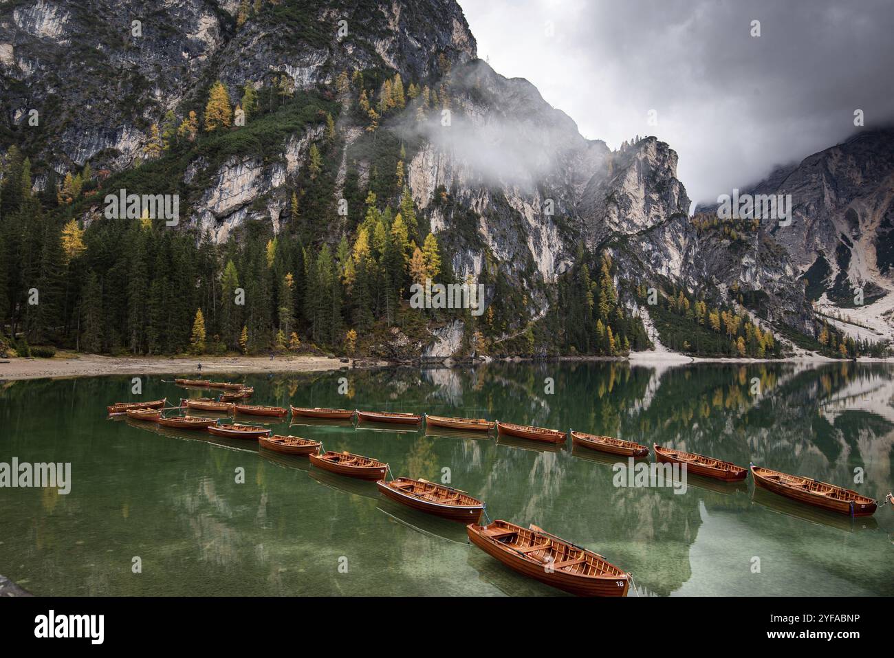 Wooden boats on the peaceful and beautiful lake lago di braies in the ...