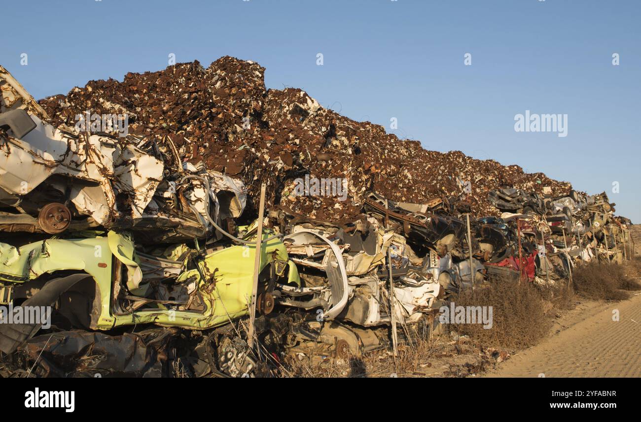 Pile of various scrap cars and other metals on a field ready for the ...