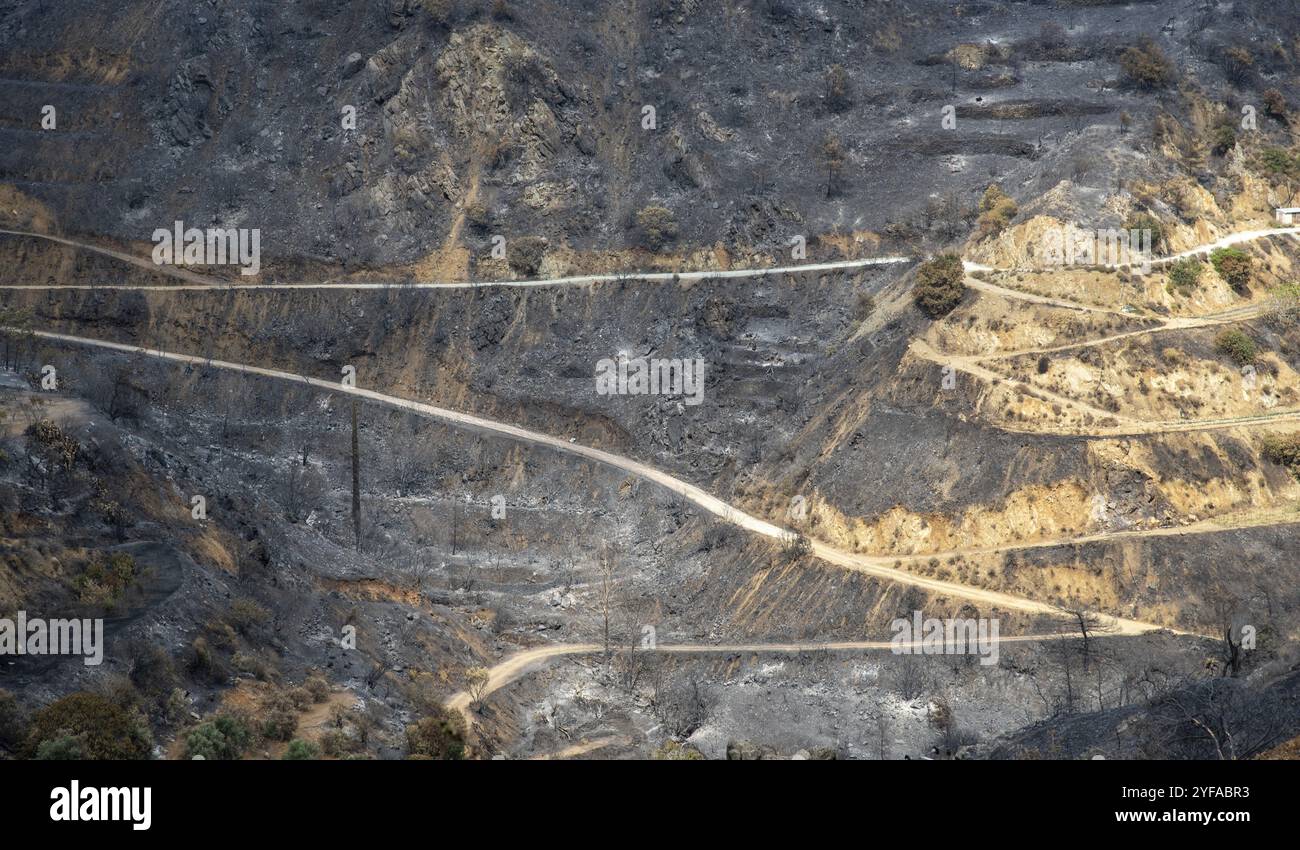 Mountain fire with burned agriculture land and forest. Odou village ...
