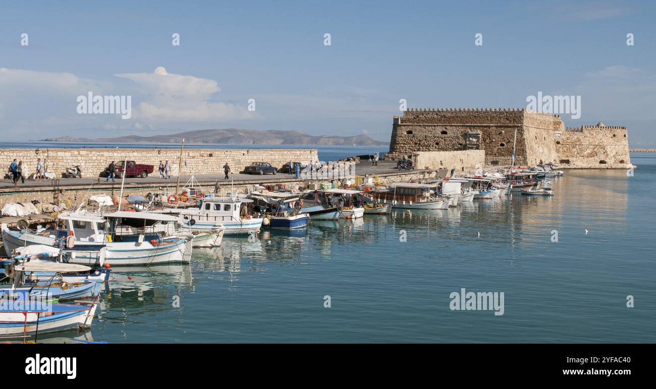 Heraklion, Crete, November 21 2012: The fishing harbour and the castle ...
