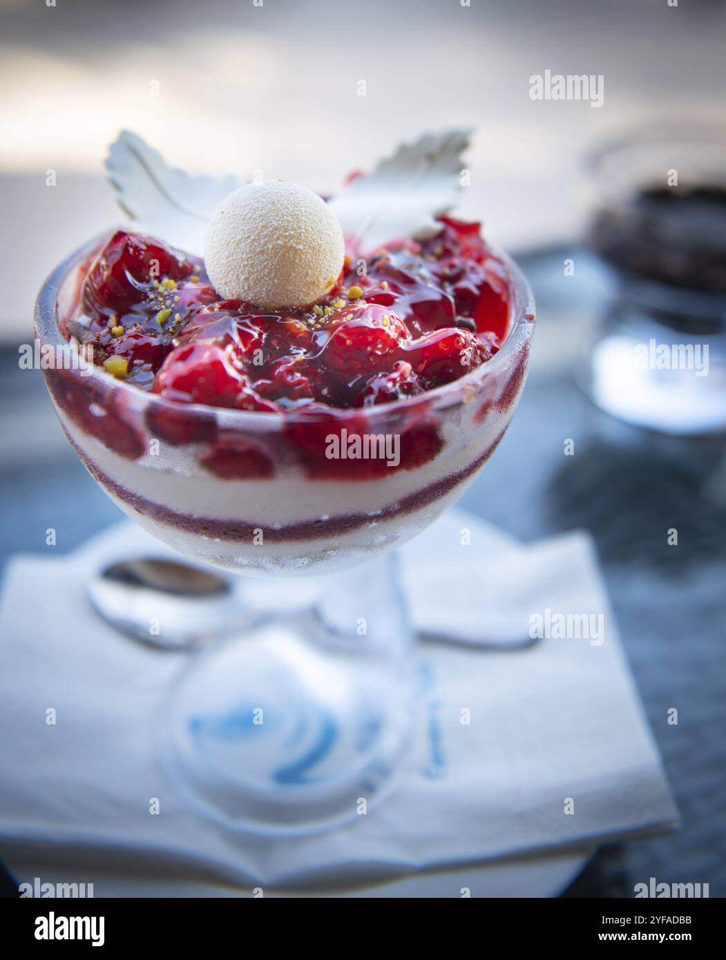 Delicious sweet cheese cake with red berries and syrup garnishes and a ...