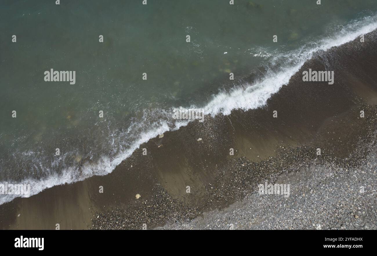 Aerial view of ocean waves braking on a sandy beach. Nature background ...