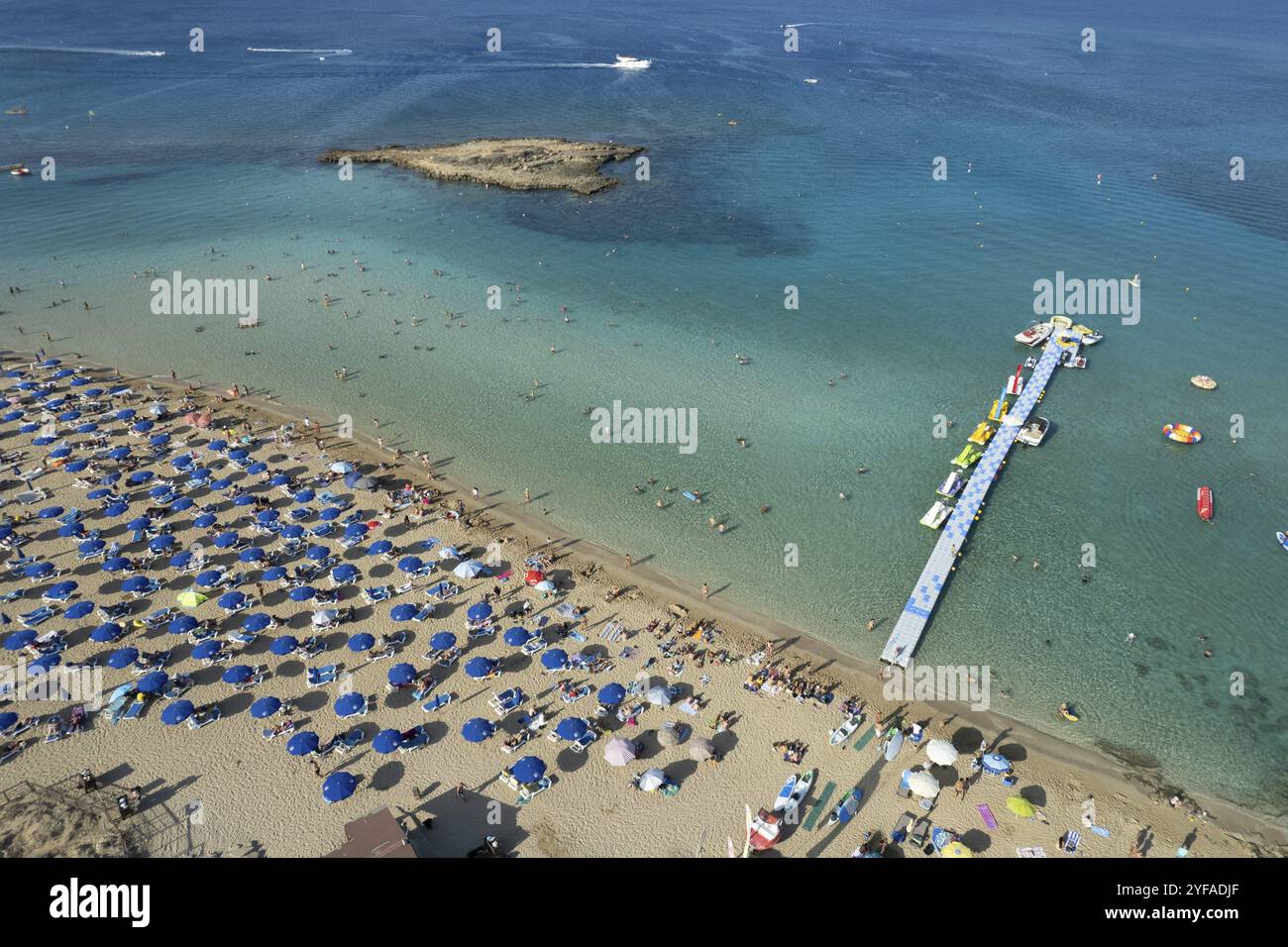 Aerial drone photograph of fig tree bay beach. with tourists relaxing ...