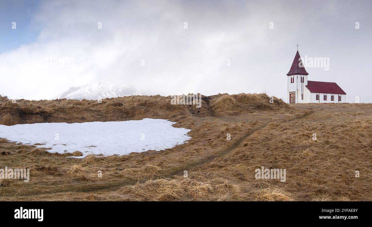 Old church in Hellnar on a cloudy day with snow on the ground at near ...