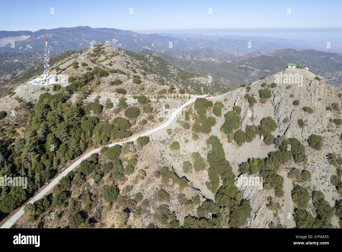 Drone aerial of mountain landscape with lookout fire tower station on ...