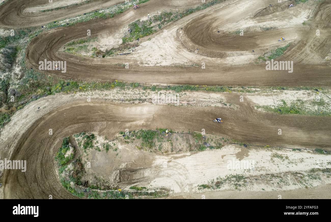 Drone aerial of a motocross race on a dirt curvy sport track. Aerial ...