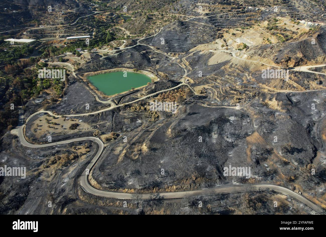 Mountain fire with burned agriculture land and forest. Odou village ...