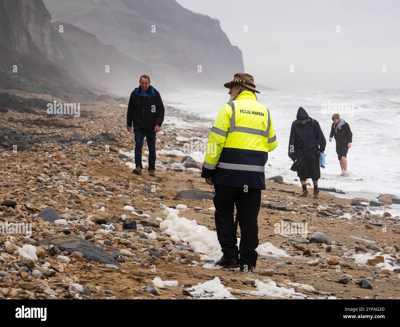 Fossil hunters and a fossil warden on the world famous fossil beach of ...