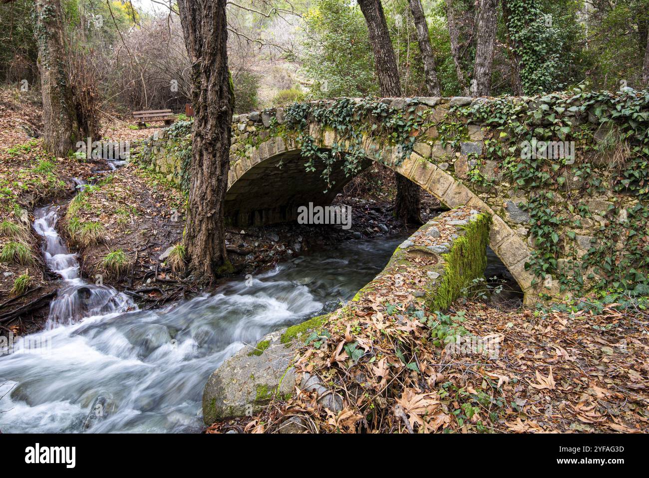 Beautiful medieval stoned bridge of Milia with river full with water ...