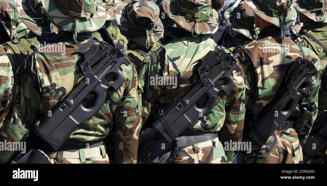 Military soldiers parading in uniform and armed with guns Stock Photo ...
