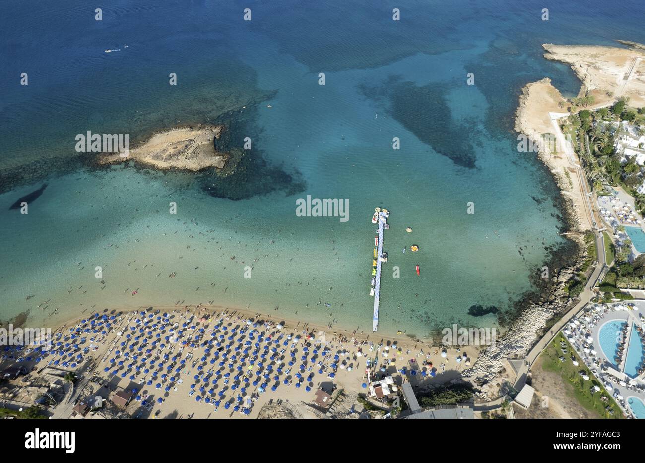 Aerial drone photograph of fig tree bay beach. with tourists relaxing ...