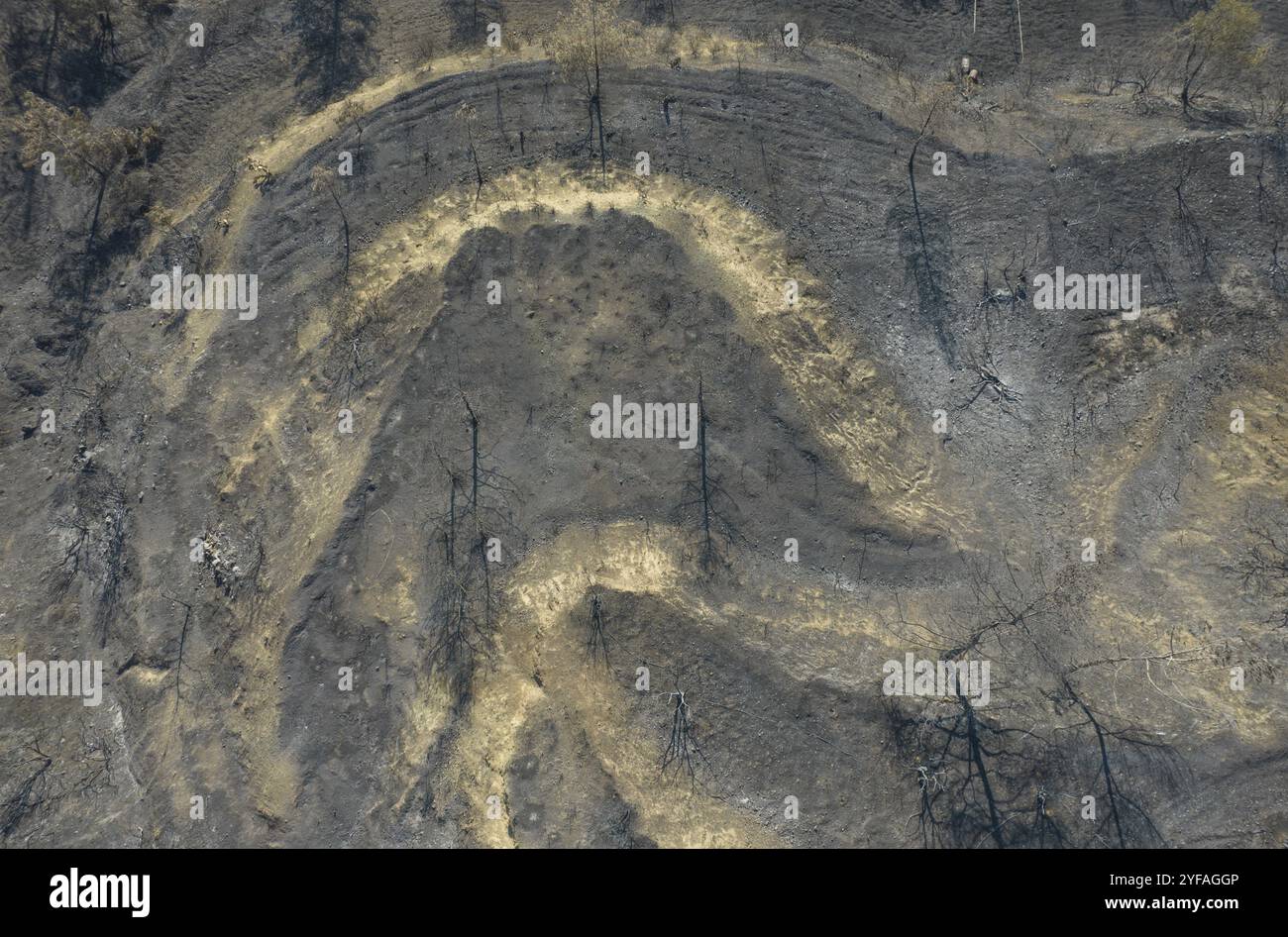Mountain fire with burned agriculture land and forest. Odou village ...