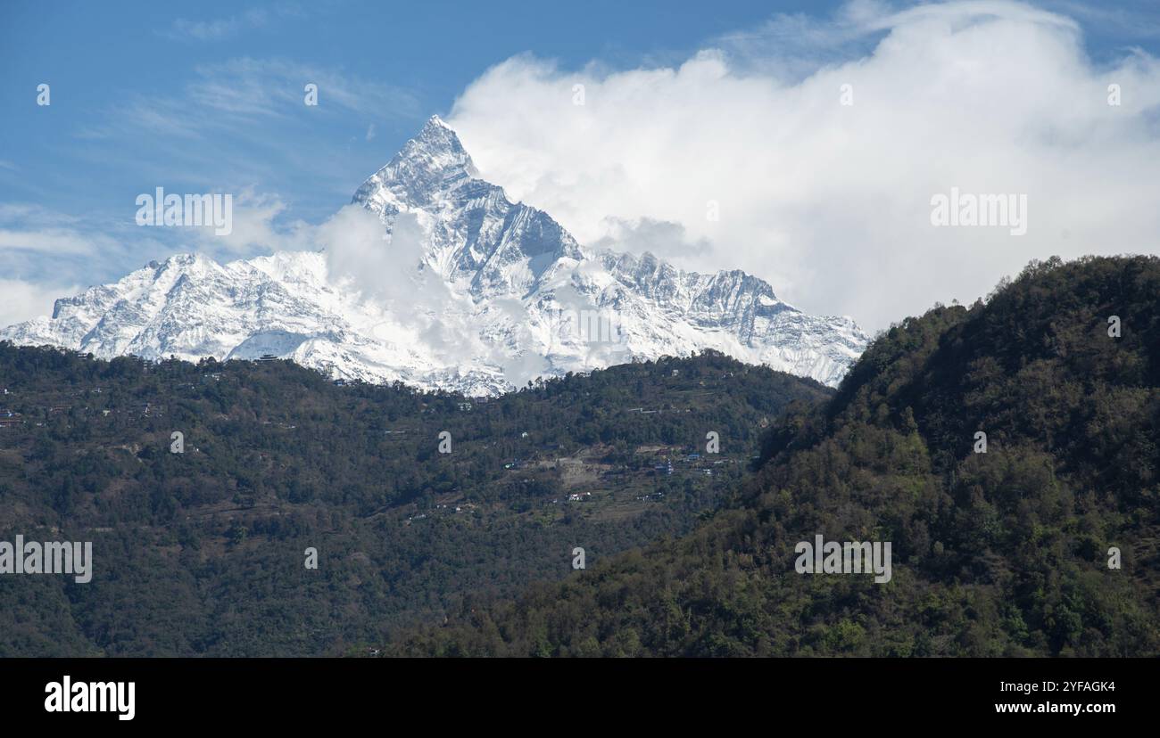 Annapurna massif mountains in the Himalayas covered in clouds, snow and ...