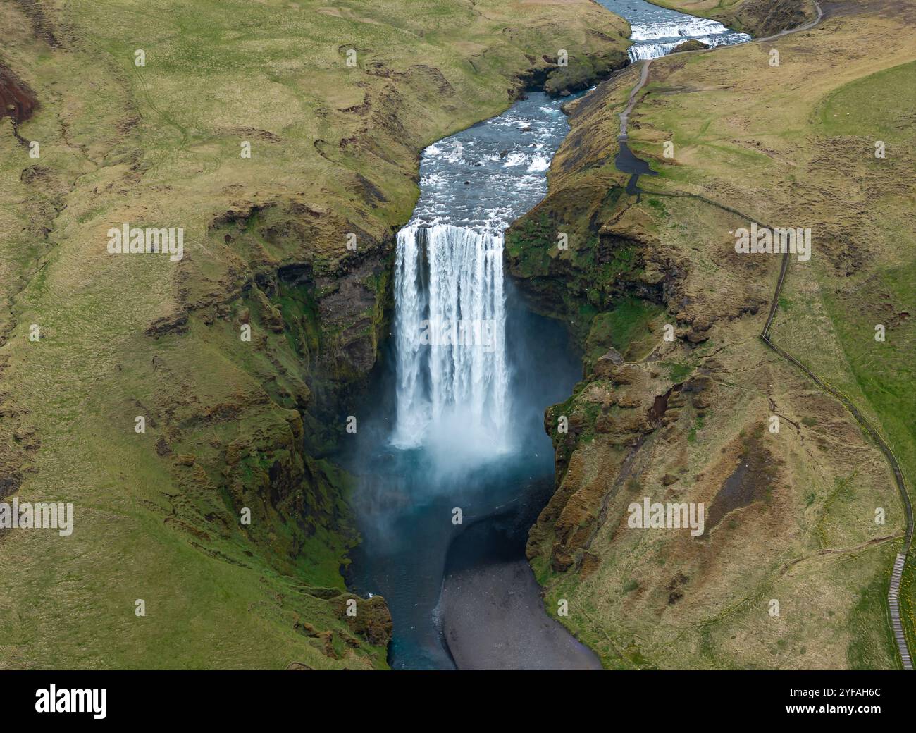 Skogafoss waterfall, a famous natural landmark and travel destination ...