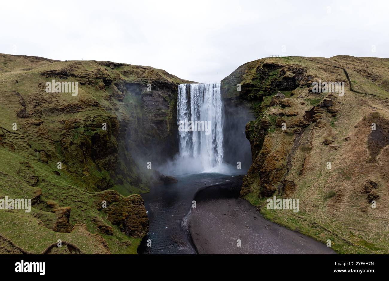 Skogafoss waterfall, a famous natural landmark and travel destination ...