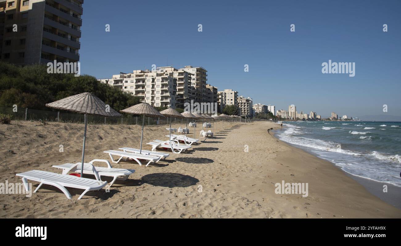 Empty sandy beach and abandoned buildings. Famagusta ghost city ...