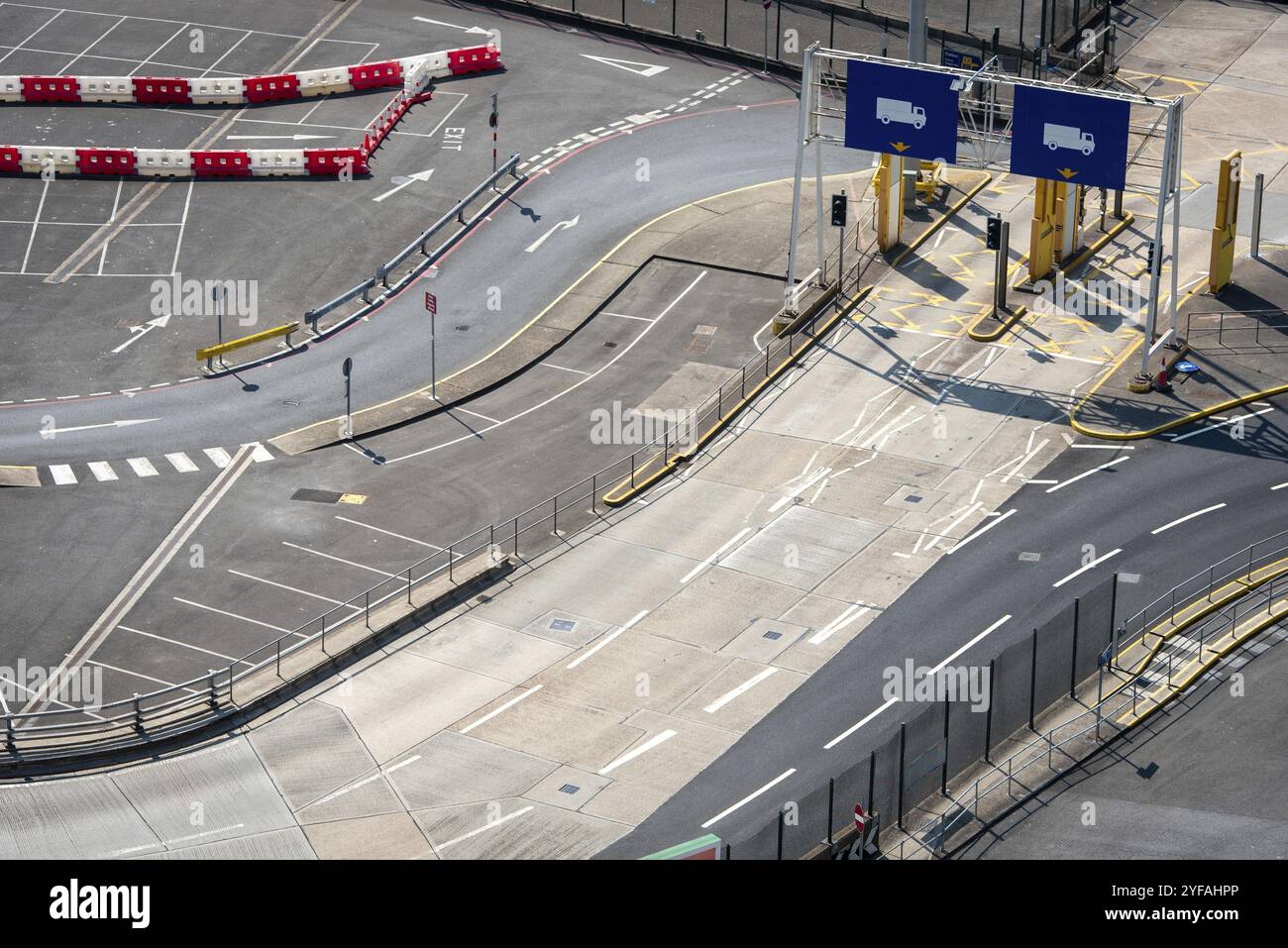 Road marking directional signs for cargo in a harbor. Public ...