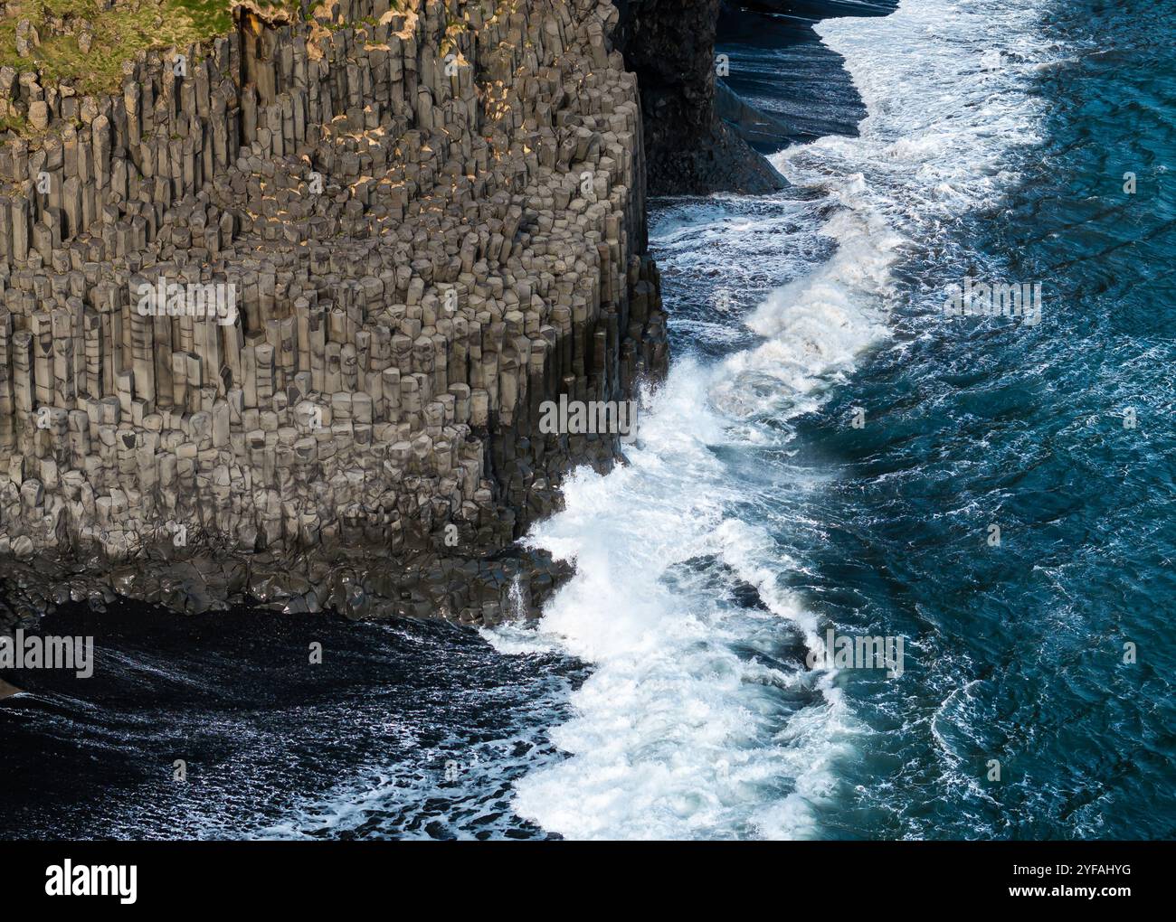 Aerial view of basalt columns and crashing waves at Reynisfjara black sand beach, Iceland Stock ...