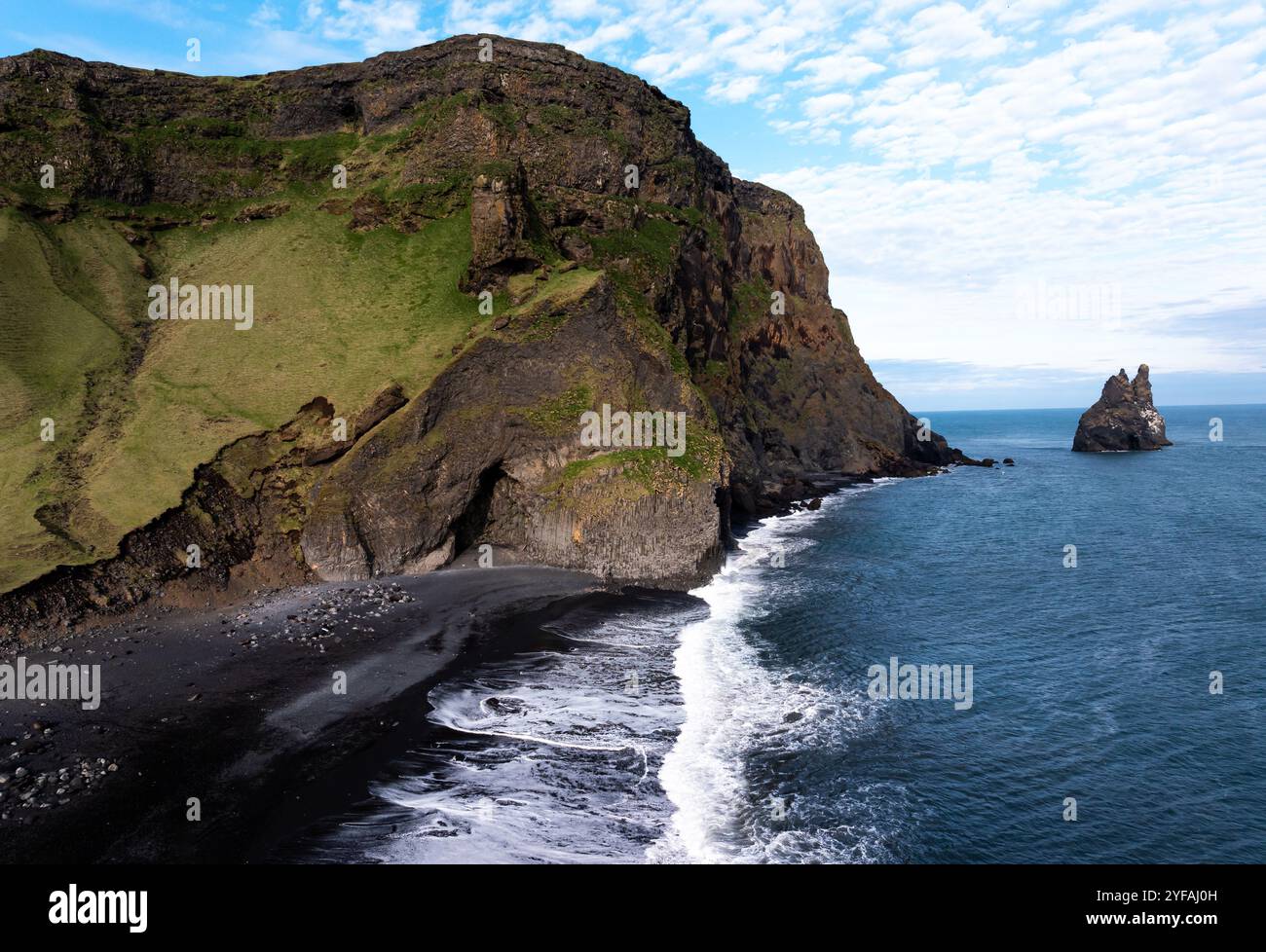 Aerial view of the cliffs and sea stacks at Reynisfjara black sand ...
