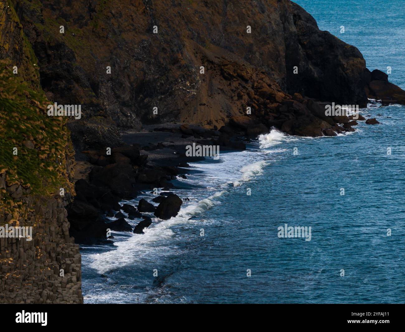 Aerial view of the cliffs and sea stacks at Reynisfjara black sand ...