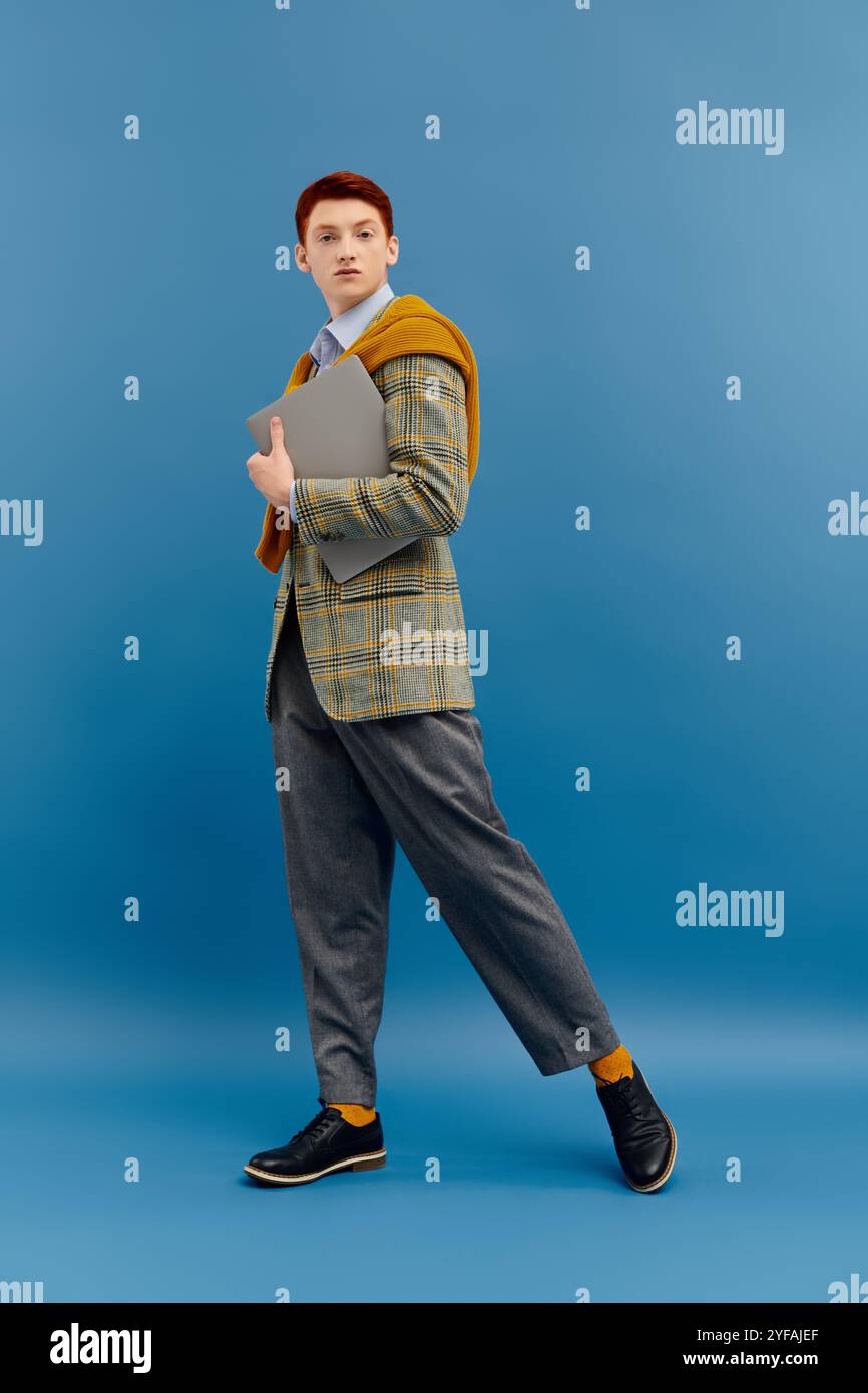 A handsome man in an elegant winter outfit poses confidently in a ...