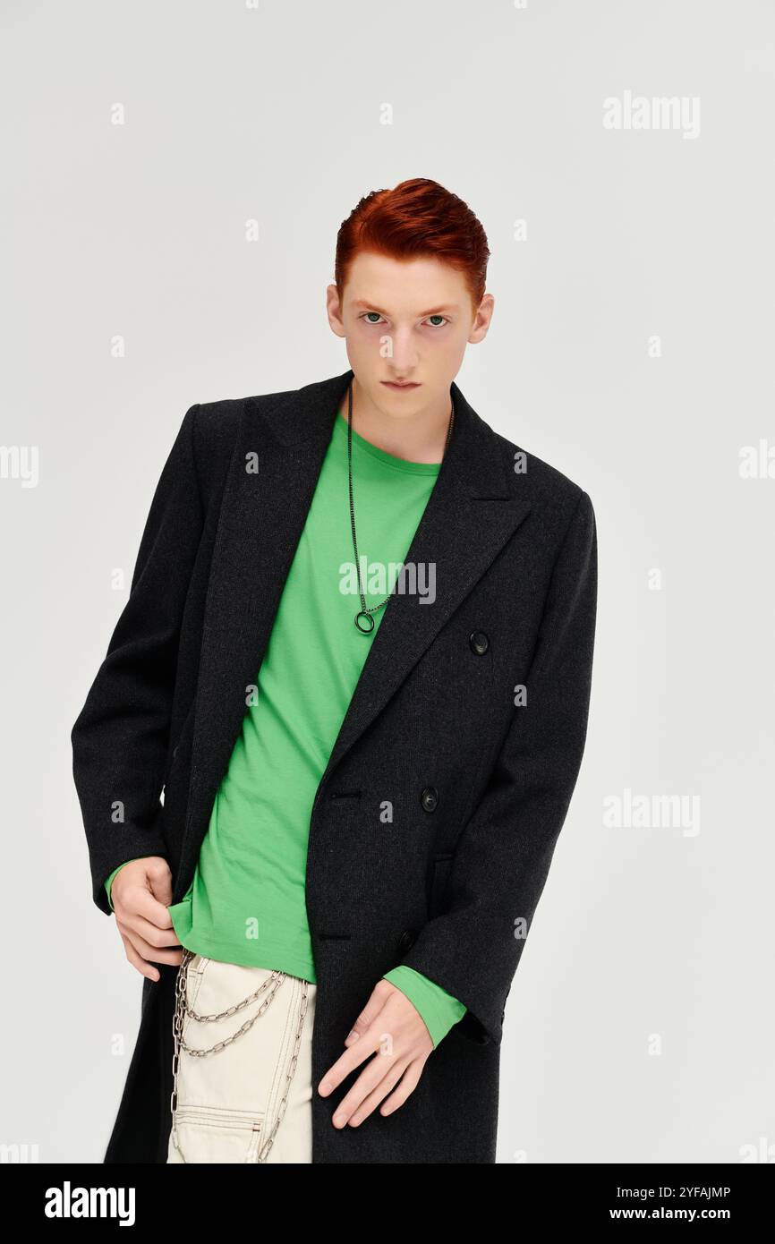 A handsome young man with red hair models an elegant winter coat in a ...