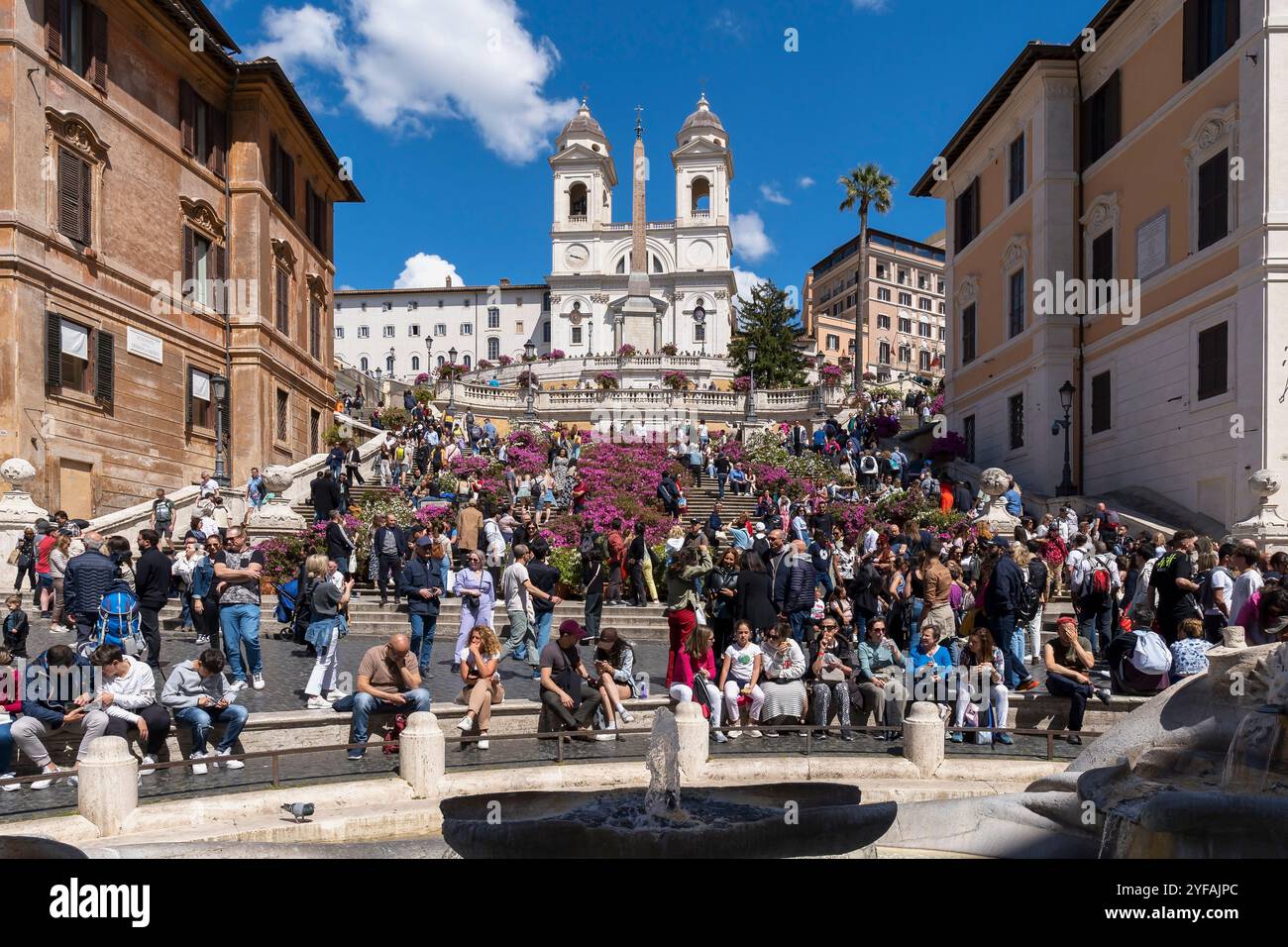 Tourists crowd the Spanish Steps, decorated every year with traditional ...
