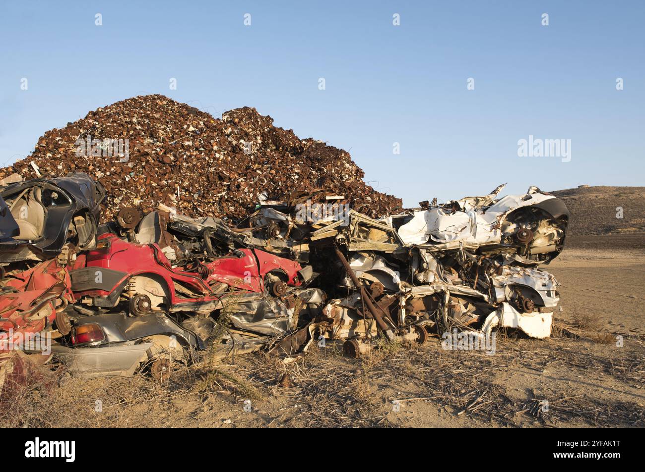 Pile of various scrap cars and other metals on a field ready for the ...