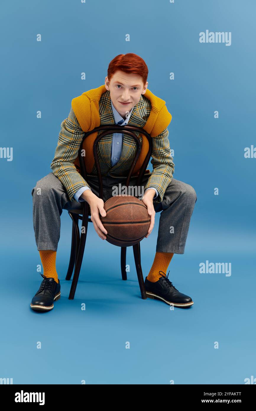 A young man wearing a layered winter outfit confidently holds a ...