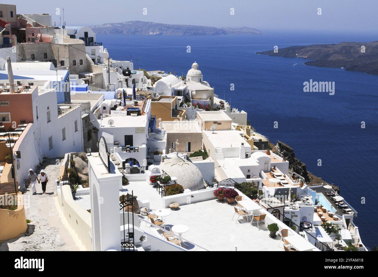 Cityscape of Fira town with white houses and the caldera in Santorini ...
