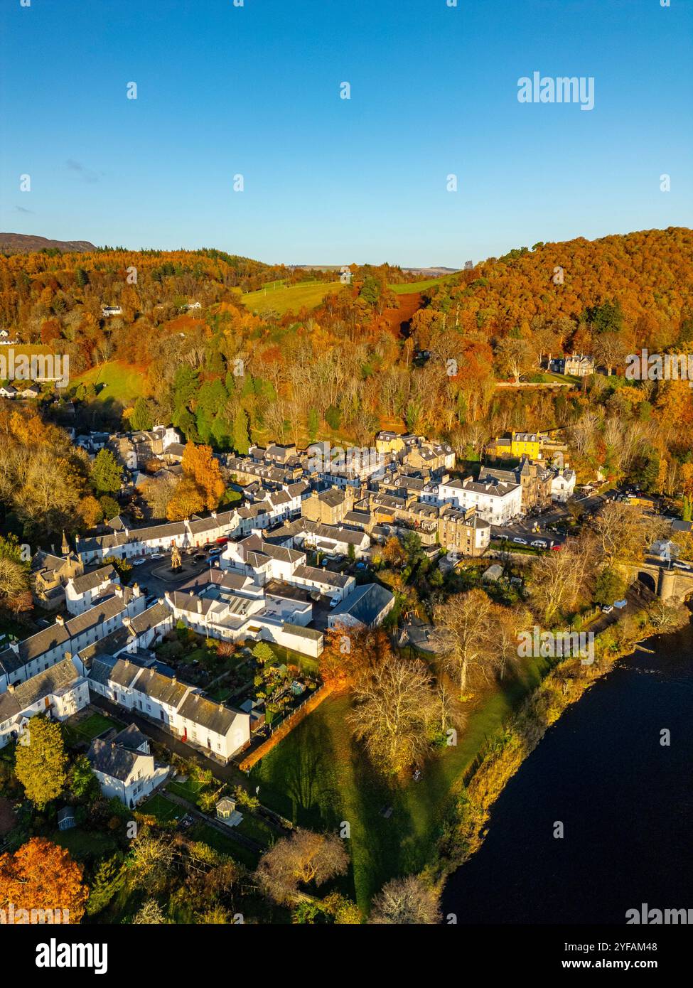 Aerial view of Dunkeld village and River Tay in autumn colours ...