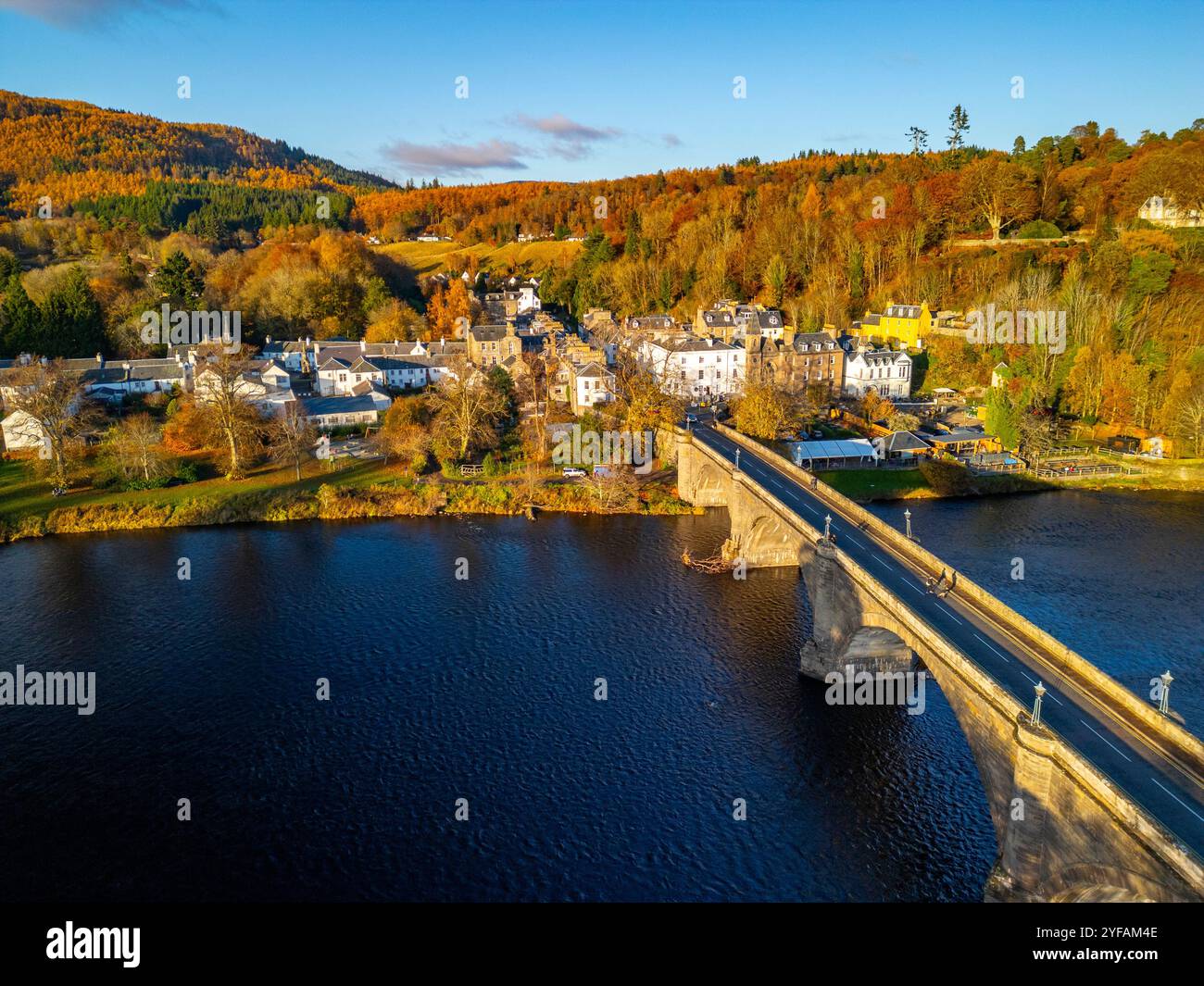 Aerial view of Dunkeld village and River Tay in autumn colours ...