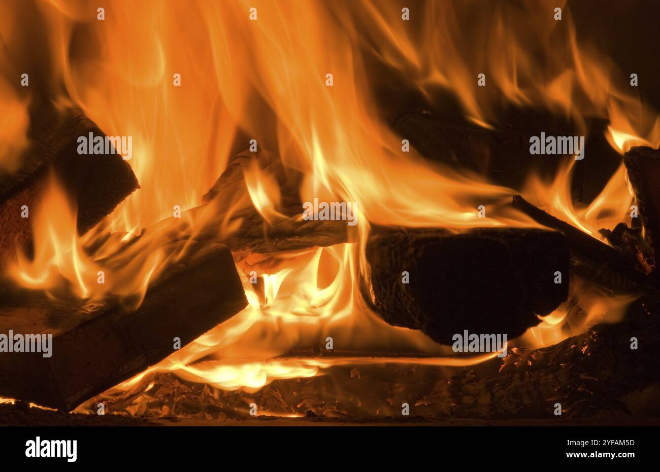 Fire place background with woods burning Stock Photo - Alamy