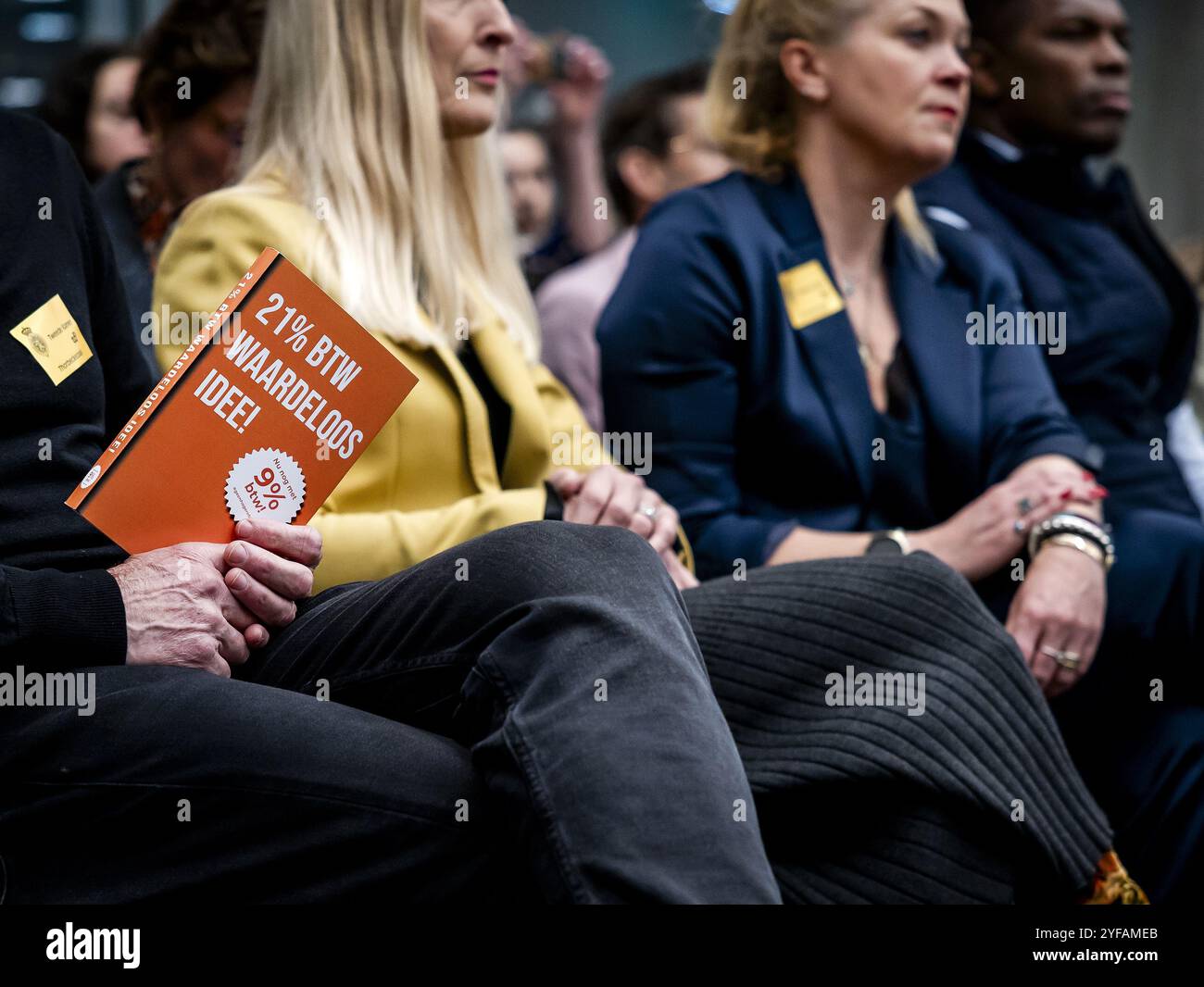 THE HAGUE - Writer Kluun holds a book during a campaign against the VAT ...