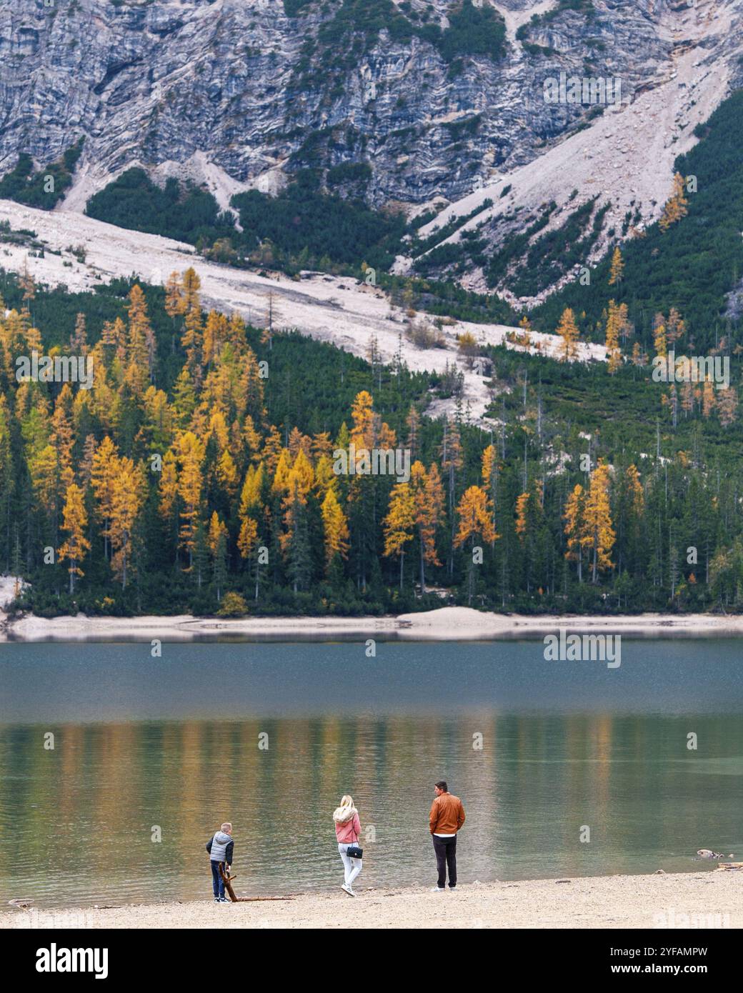 Family at the Lago di Braise in the Italian alps in Autumn. Italy South ...