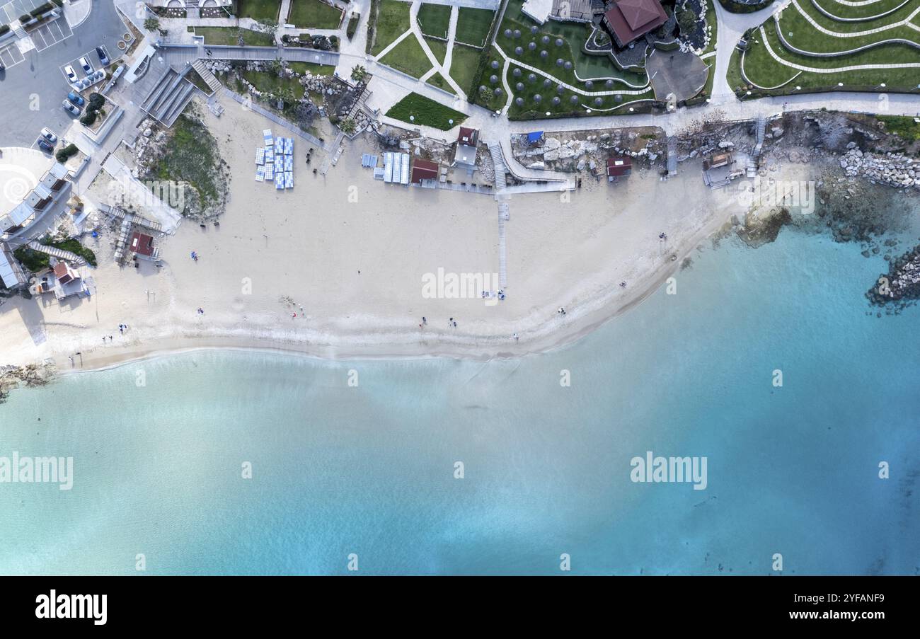 Drone aerial top view of fig tree sandy bay beach in winter. Idyllic ...