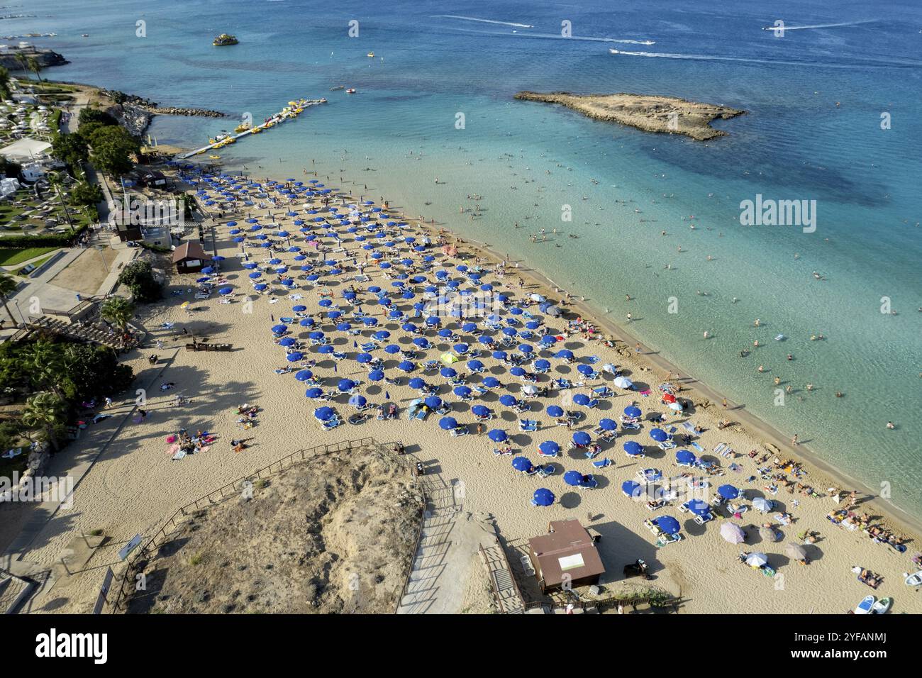 Aerial drone photograph of fig tree bay beach. with tourists relaxing ...