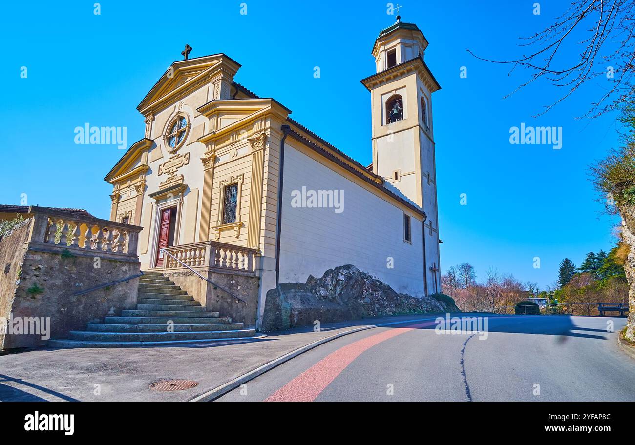 The facade of San Siro Church, decorated with wall columns and stucco ...