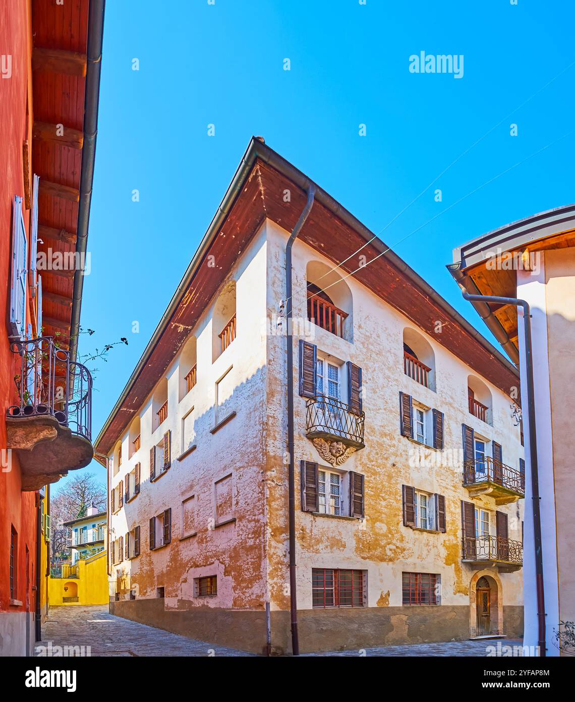 The corner of historic townhouse on the narrow street, Carona, Ticino ...