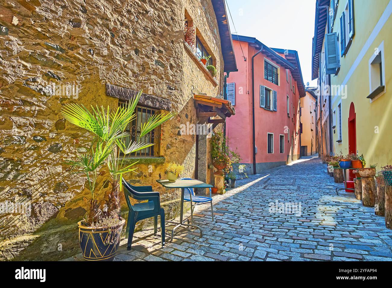 The stroll along the medieval street in old town (Nucleo) of Carona ...