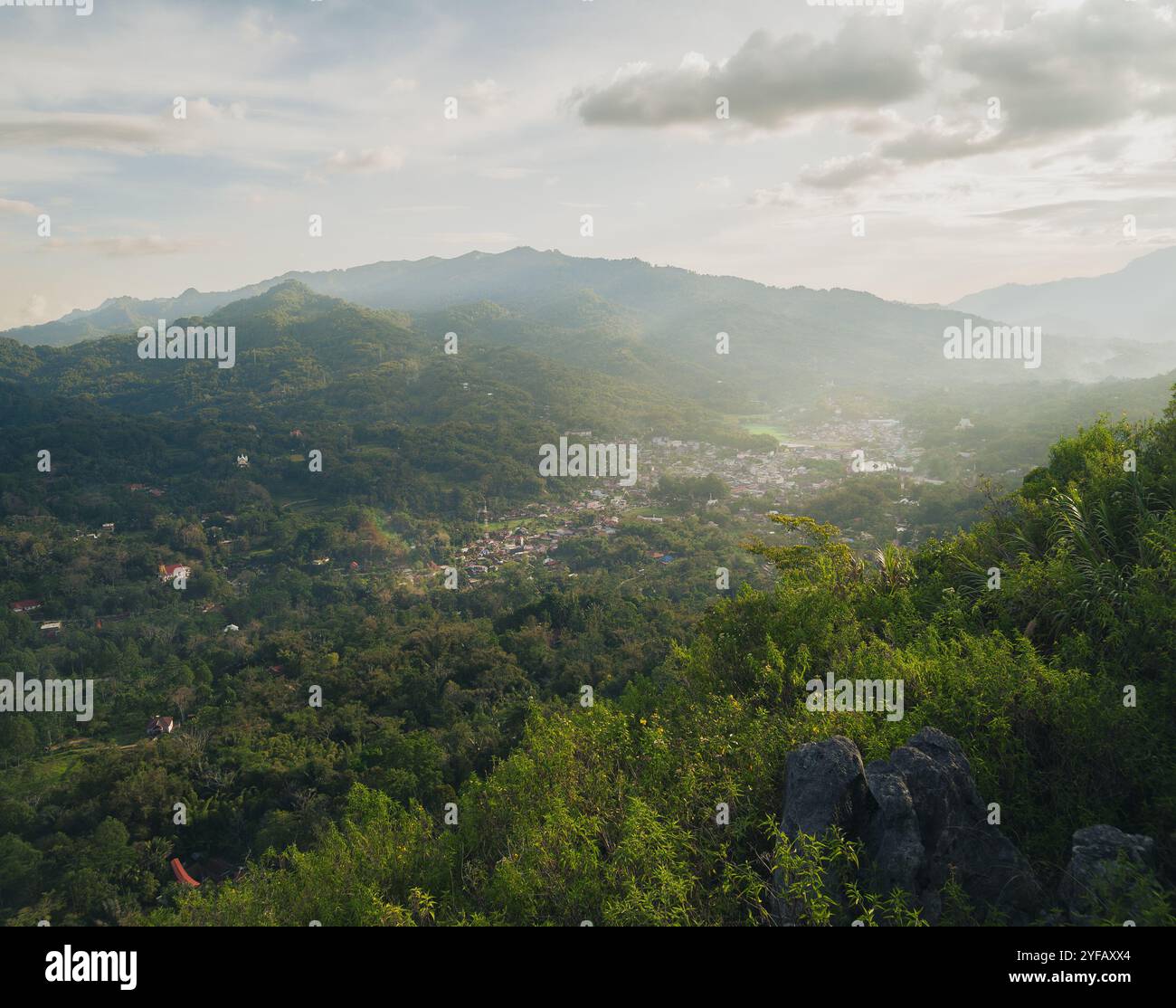 View of the mist-covered mountains of Tana Toraja seen from the top of ...